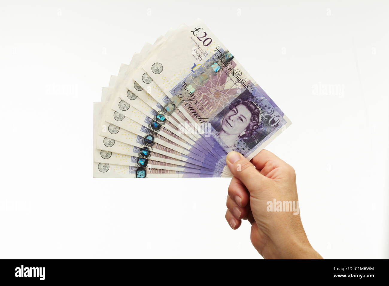 Fan of Twenty Pound Notes with Hand Stock Photo - Alamy