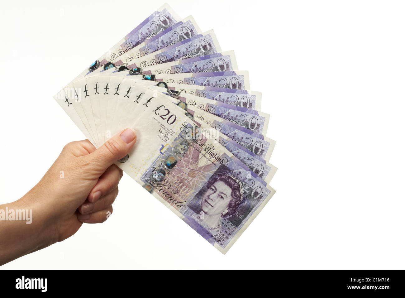 Fan of Twenty Pound Notes with Hand Stock Photo - Alamy