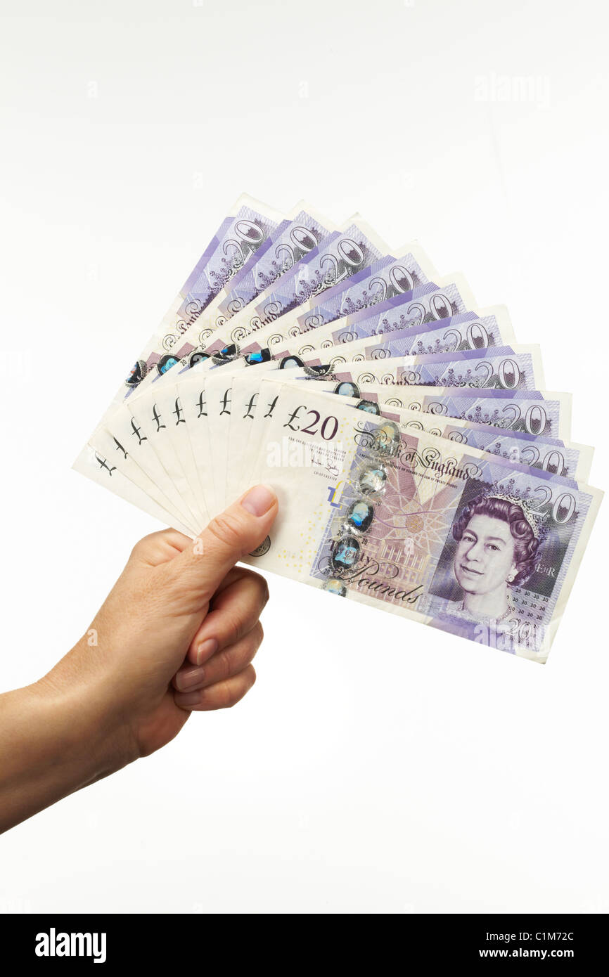 verticalFan of Twenty Pound Notes with Hand Stock Photo - Alamy