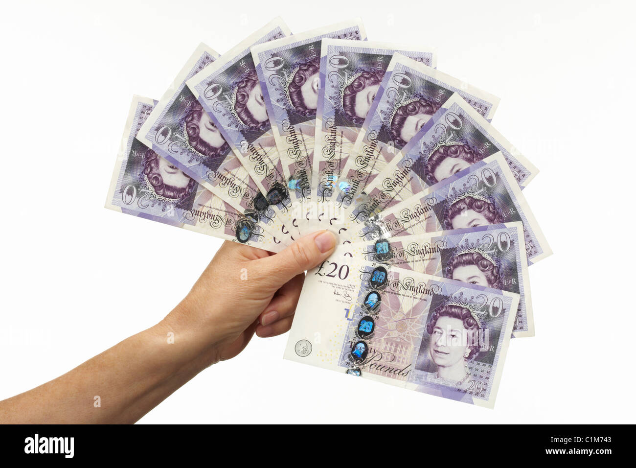 Fan of Twenty Pound Notes with Hand Stock Photo - Alamy