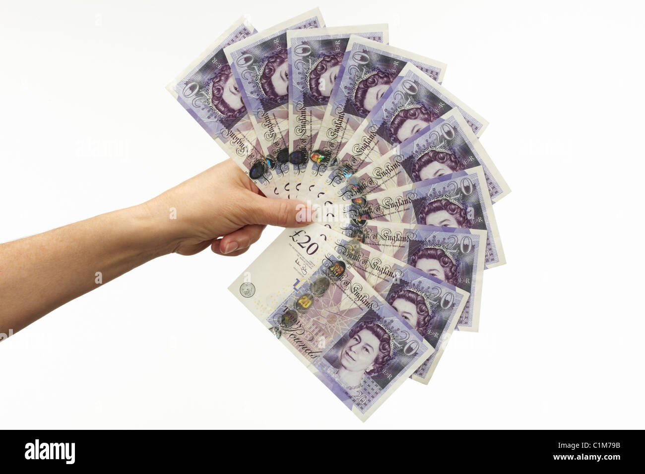 Fan of Twenty Pound Notes with Hand Stock Photo - Alamy