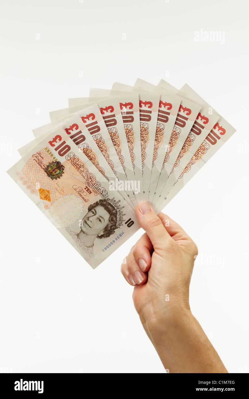 Fan of Ten Pound Notes with Hand Stock Photo - Alamy