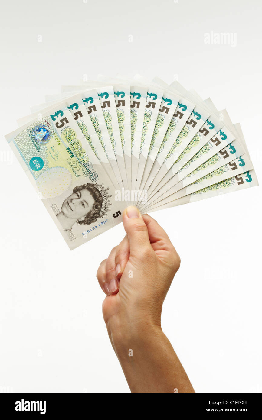 Fan of Five Pound Notes with Hand Stock Photo - Alamy