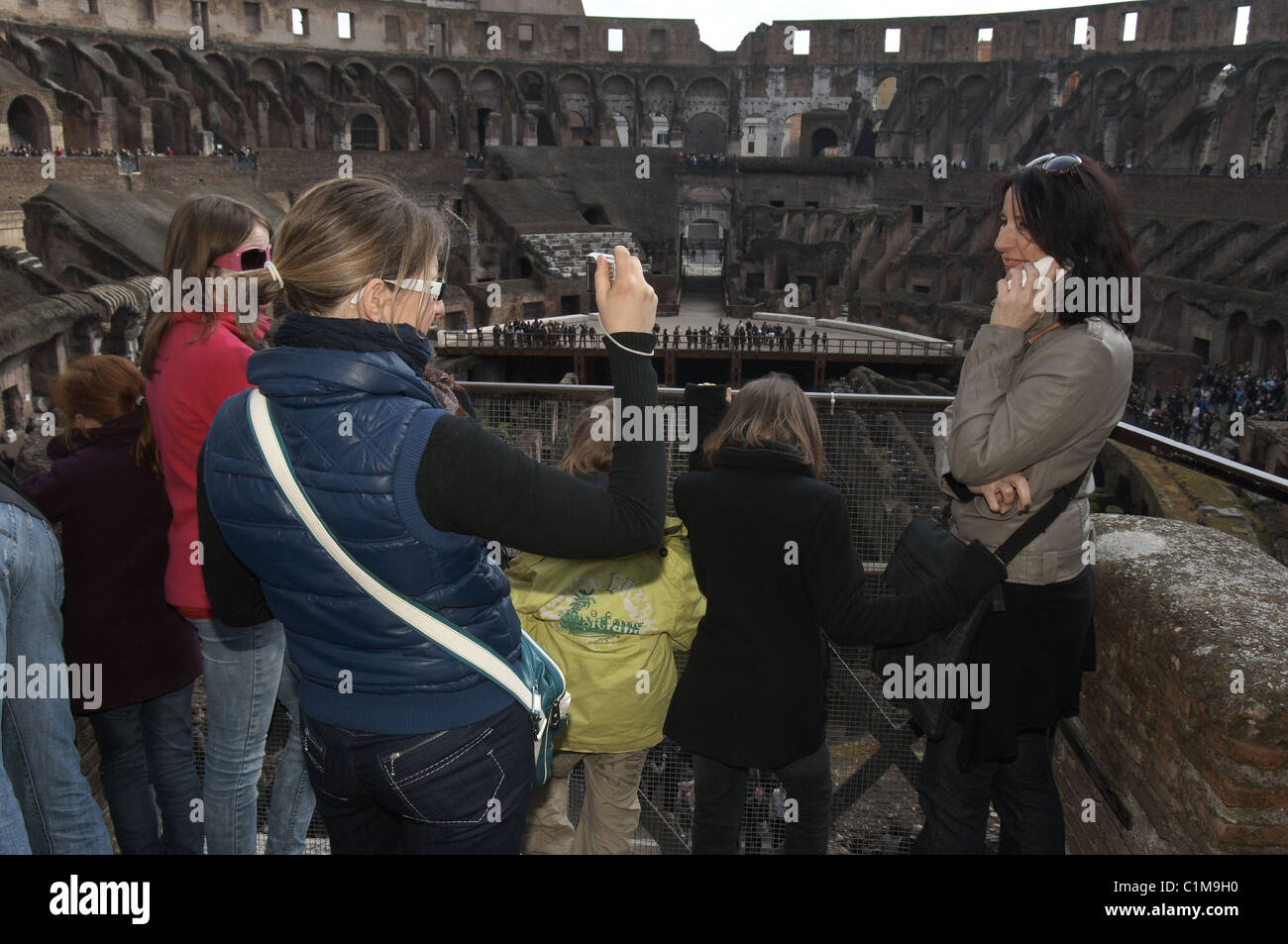 Female tourists in Rome, Italy, Europe, at the Colosseum taking ...