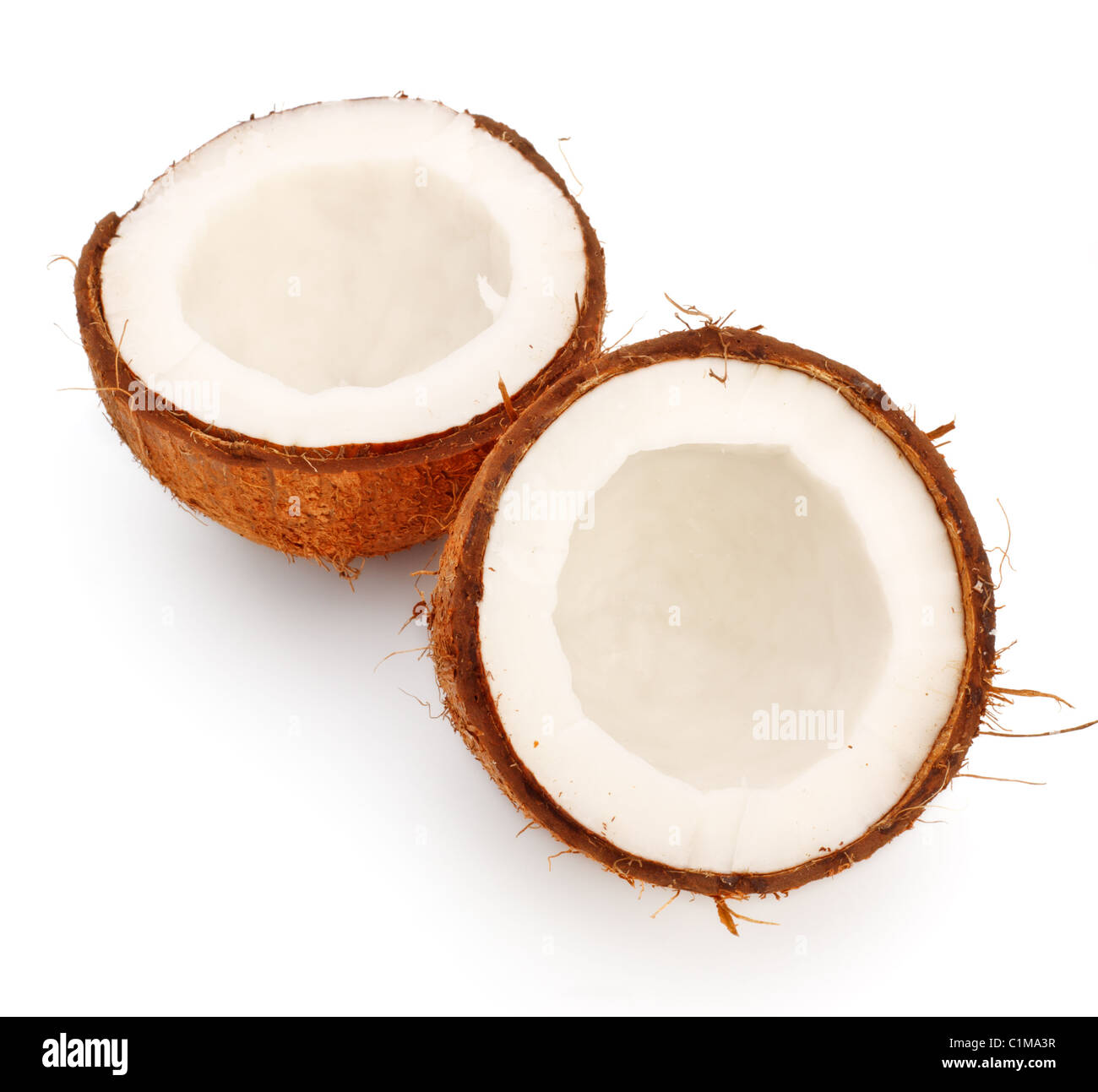 fresh coconut halves isolated on white background Stock Photo - Alamy