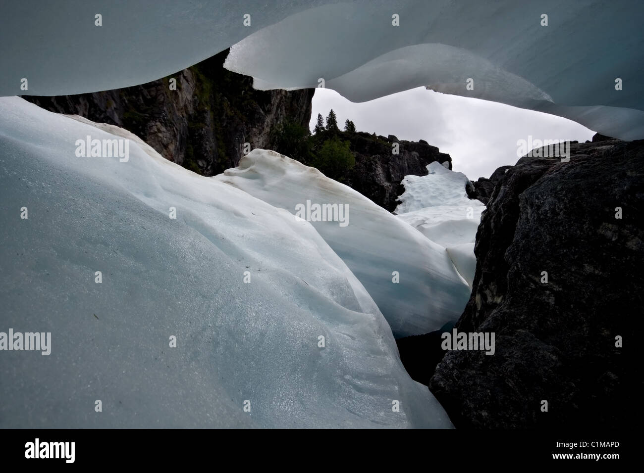 Fantastic blue wavy ice shapes (glacier) in Sayan mountains. Wild ...