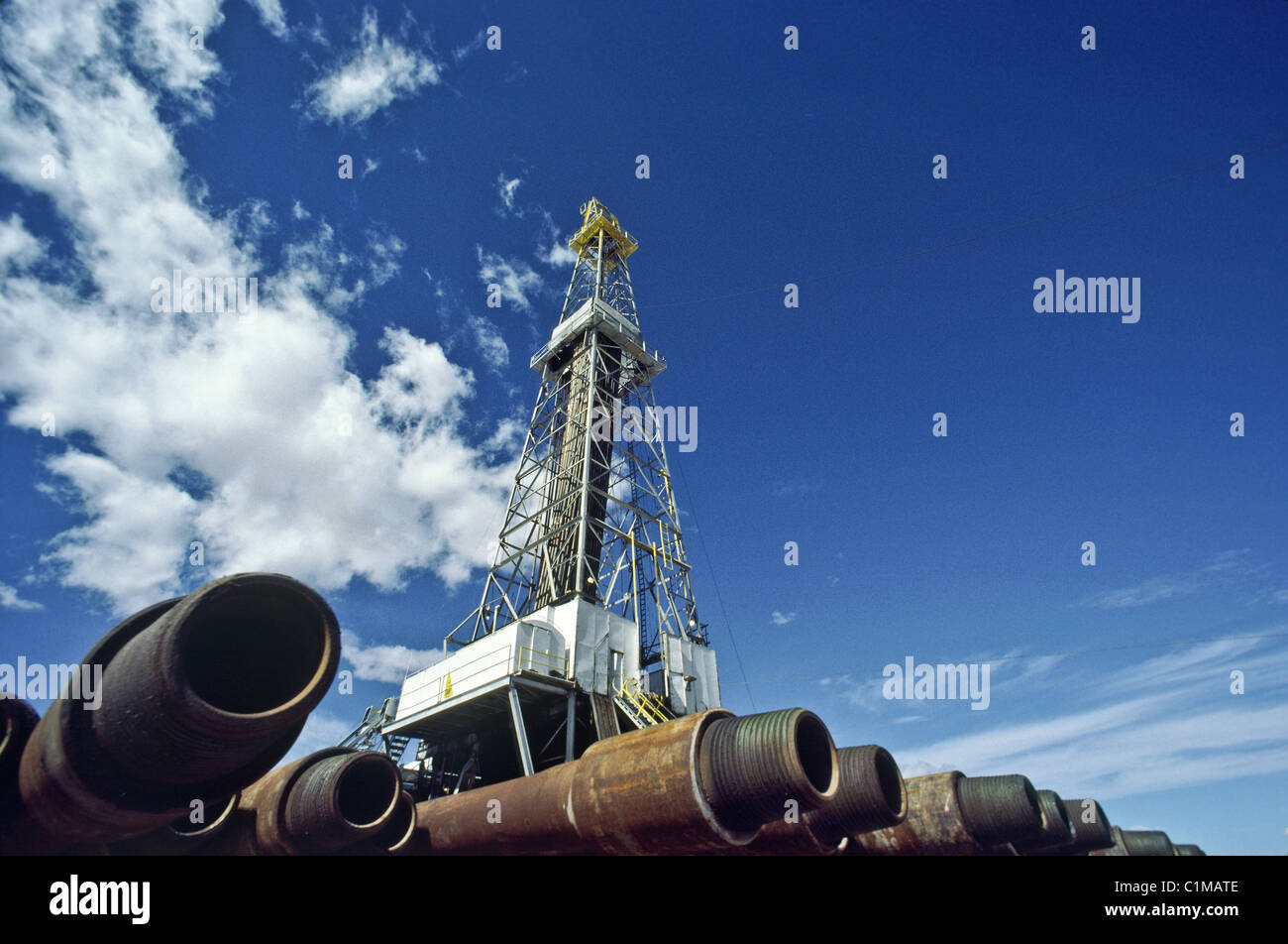 Low angle view of drilling rig from drill pipe or drill stem stack ...