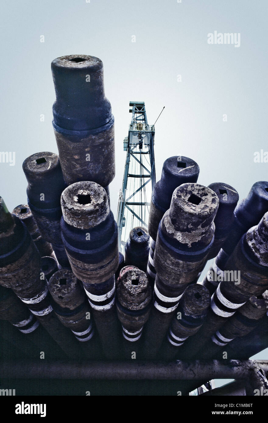 Low angle view of stacked drill pipe or drill stem, used on a drilling ...