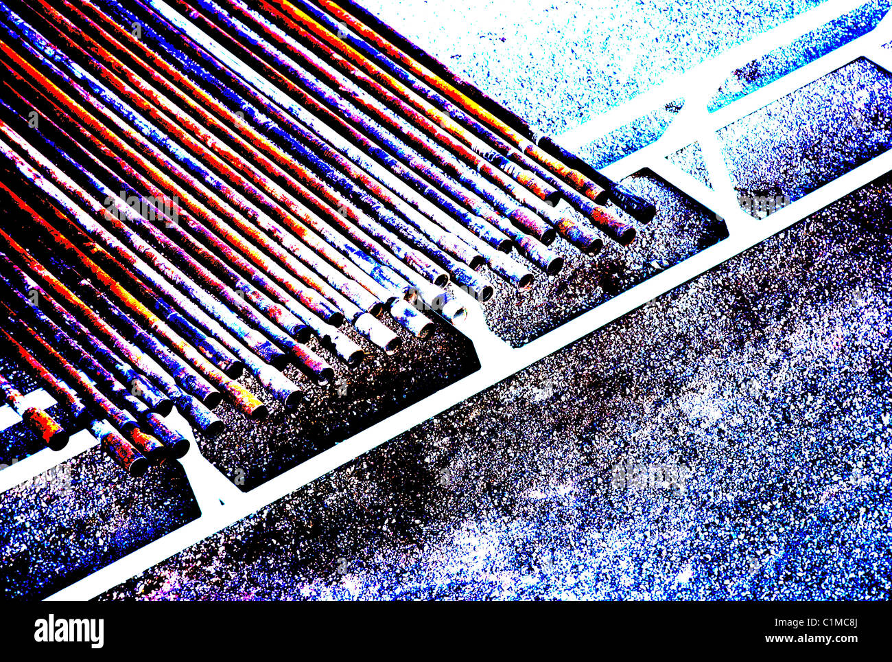 Overview of drill pipe stack at oil rig site, pointillism effect Stock ...