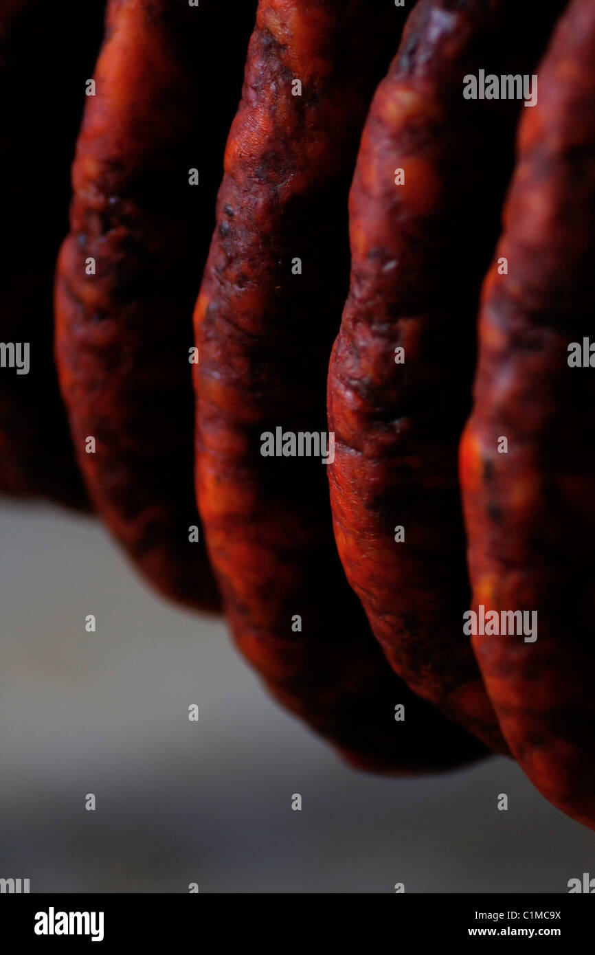 Group of aligned traditional portuguese chorizos hanging, in the curing ...