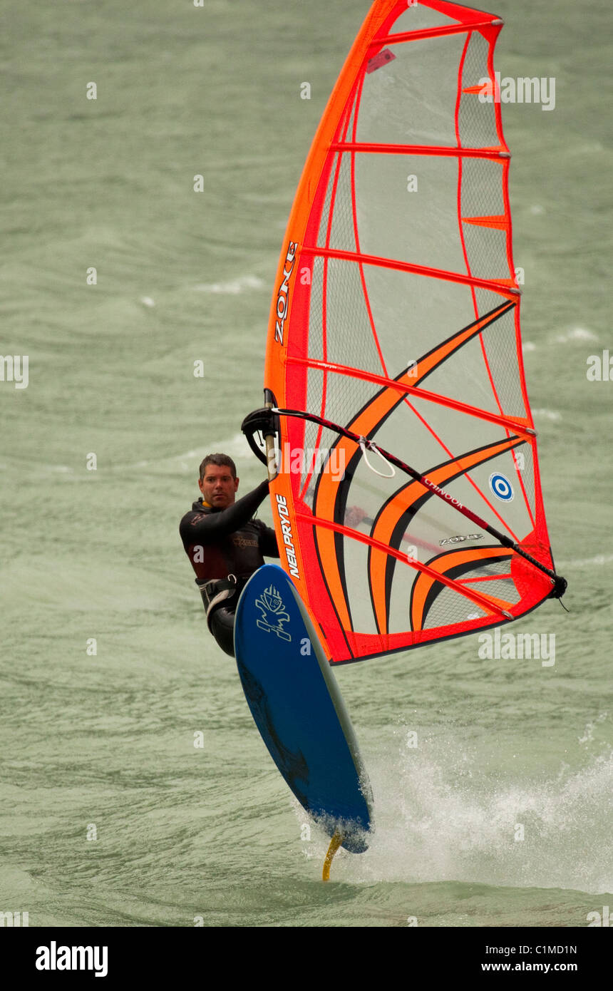 A windsurfer catches the wind at "the Spit", Squamish, BC, Canada Stock ...