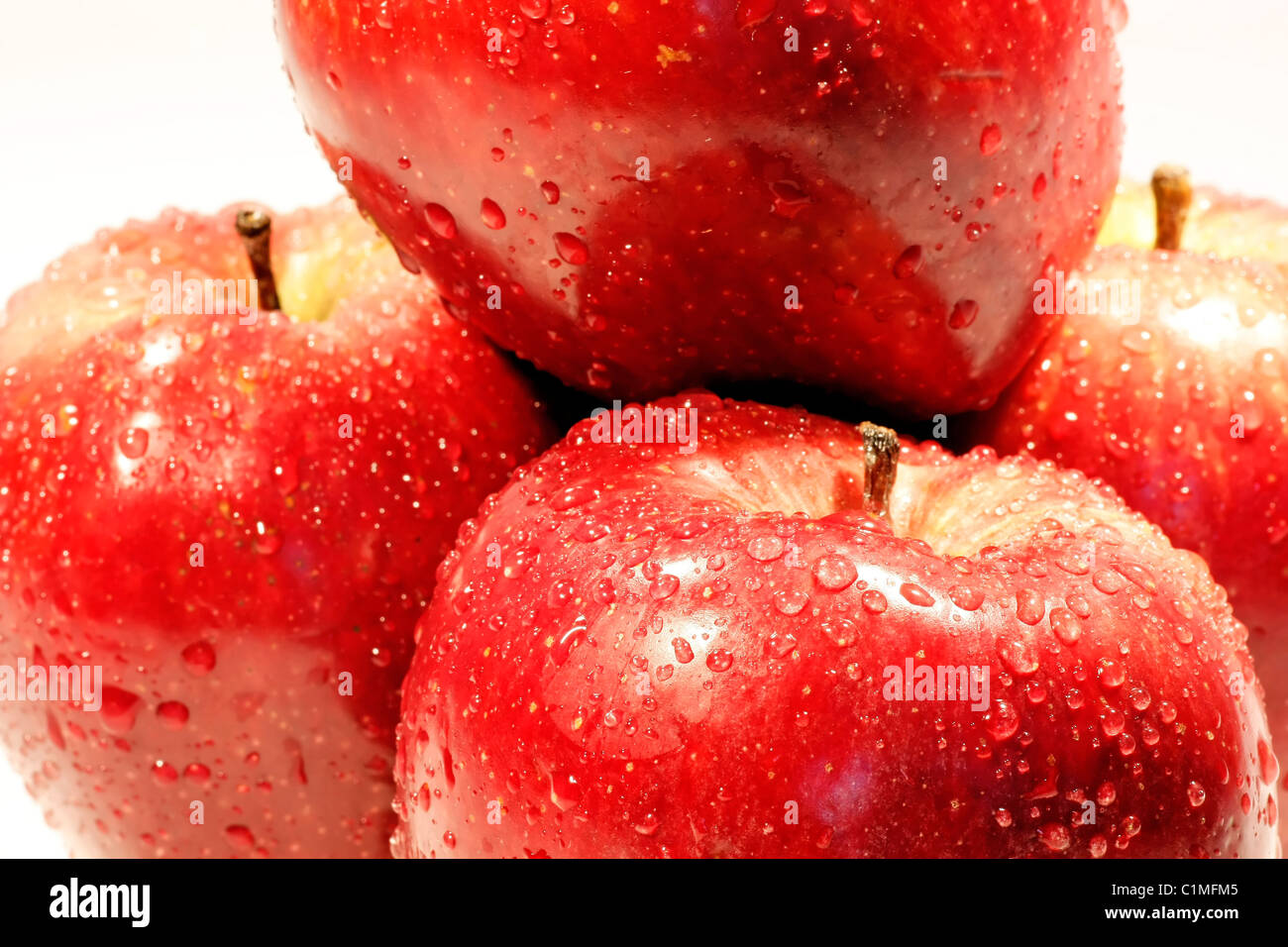 Bunch of red apples, on top of each other, isolated on a white ...