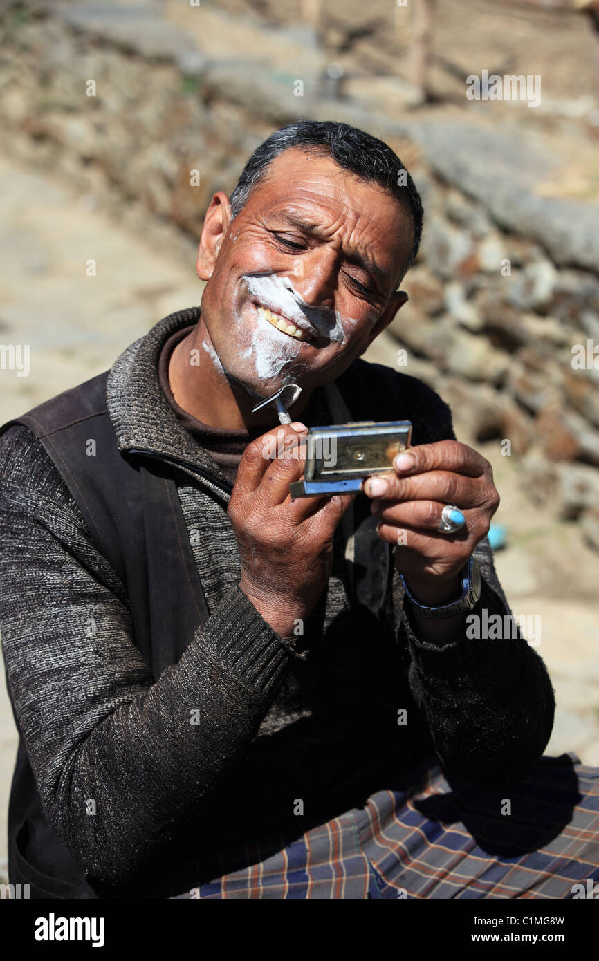 Nepali man shaving himself Nepal Himalaya Stock Photo - Alamy
