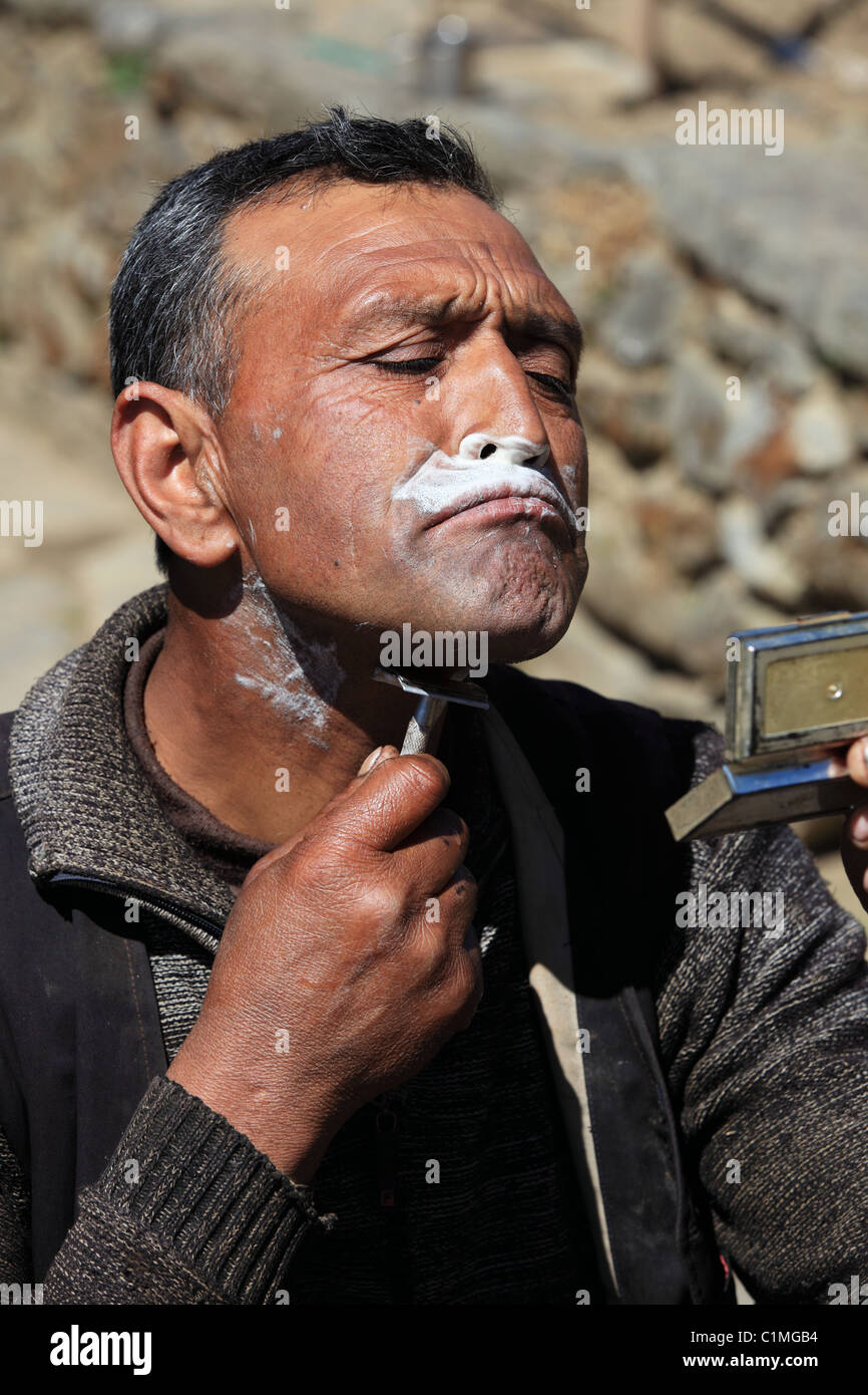 Nepali man shaving himself Nepal Himalaya Stock Photo - Alamy