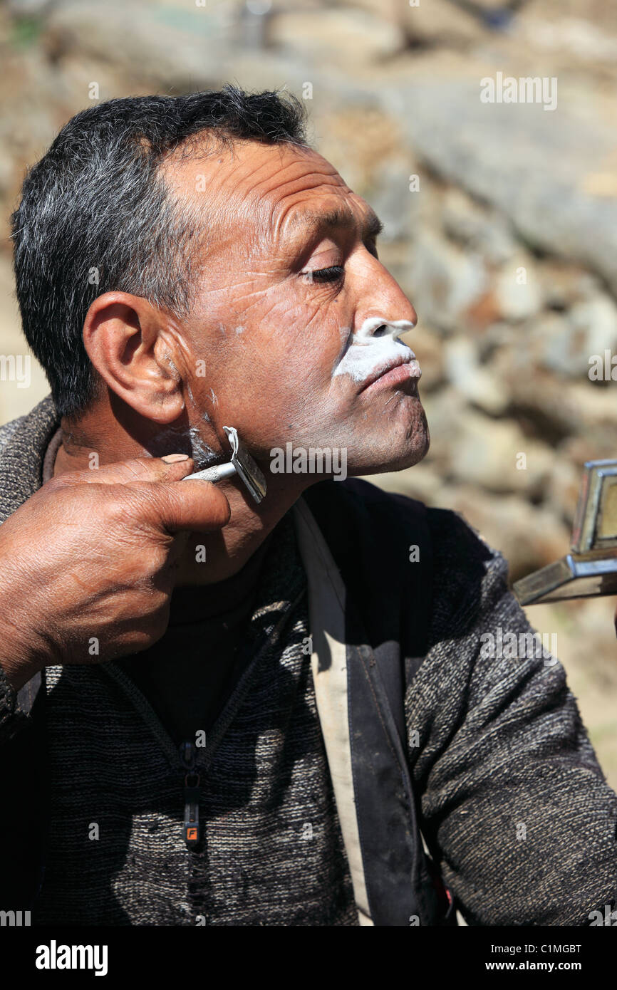 Nepali man shaving himself Nepal Himalaya Stock Photo - Alamy