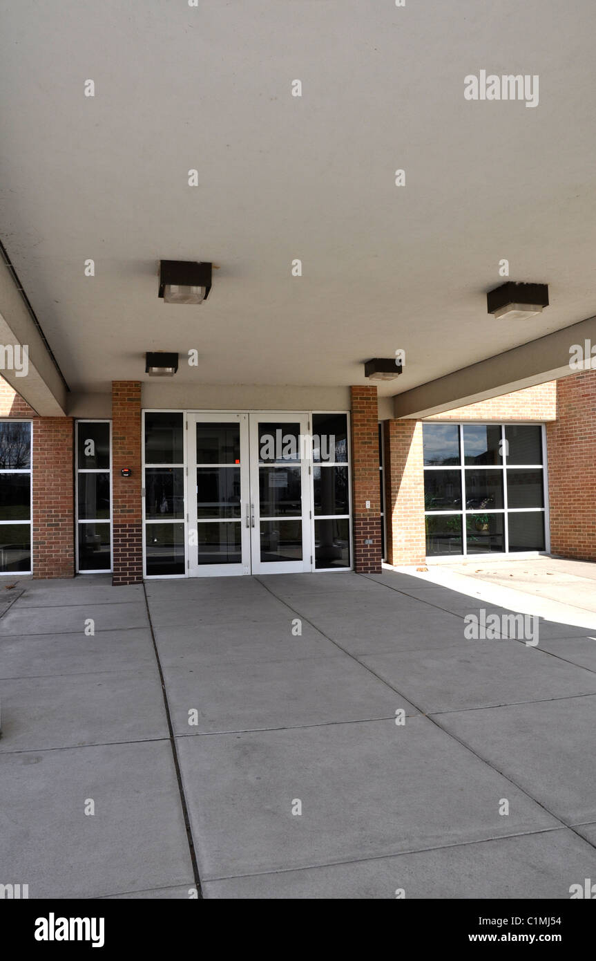 Covered entry doors for a modern school building Stock Photo - Alamy