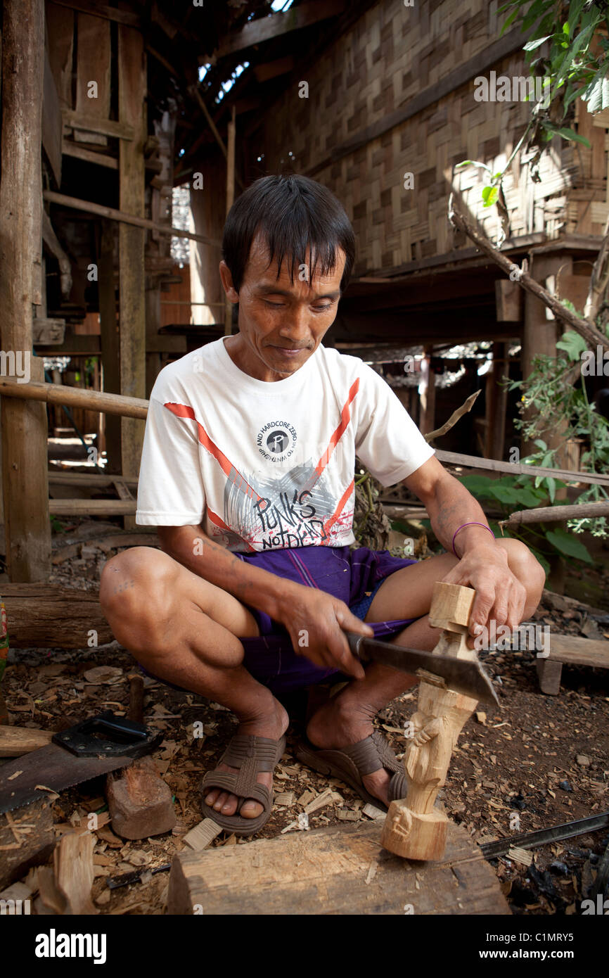 Karen Long Neck man carving Long neck wooden doll, Huay Pu Keng Stock ...