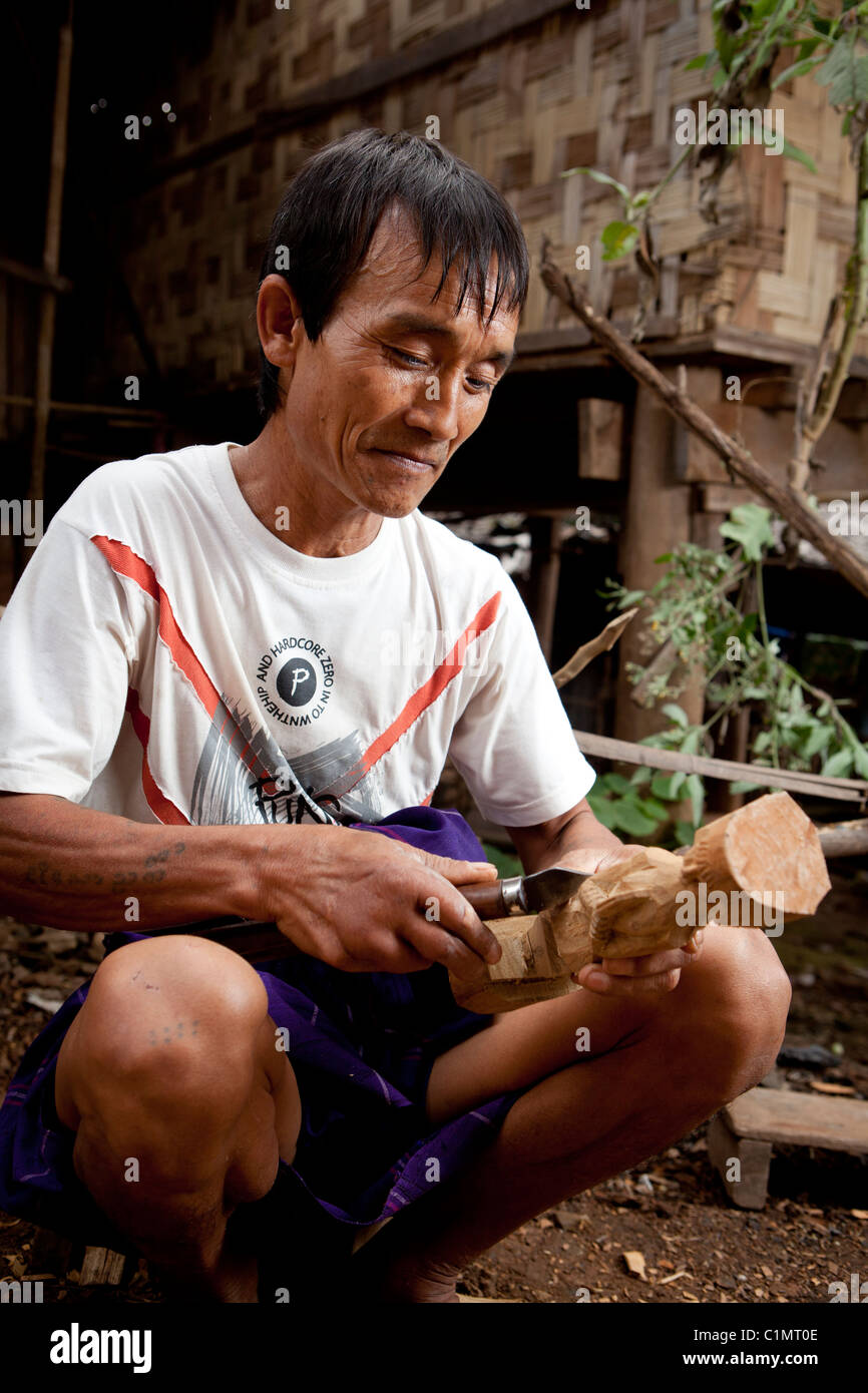Karen Long Neck man carving Long neck wooden doll, Huay Pu Keng Stock ...