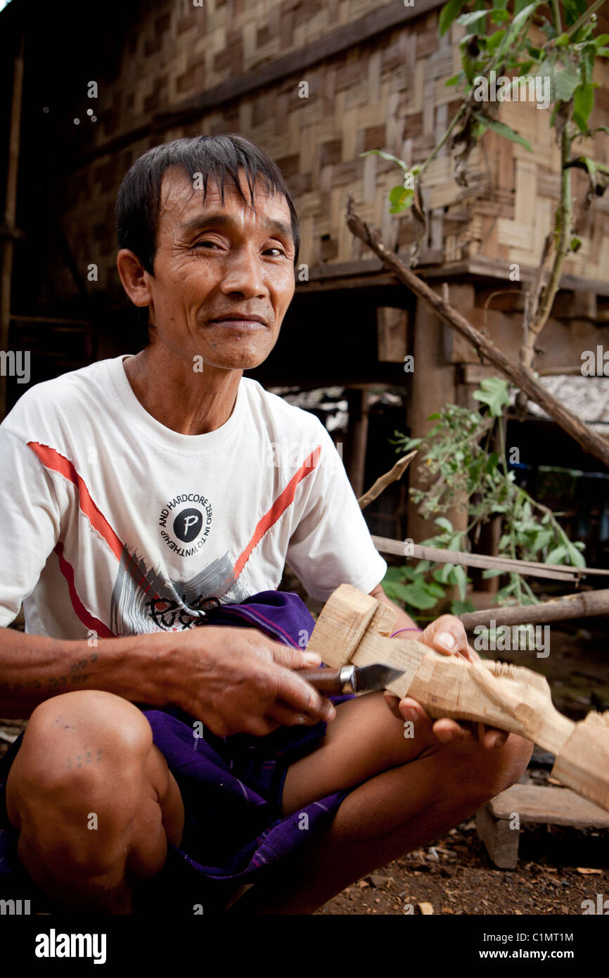 Karen Long Neck man carving Long neck wooden doll, Huay Pu Keng Stock ...