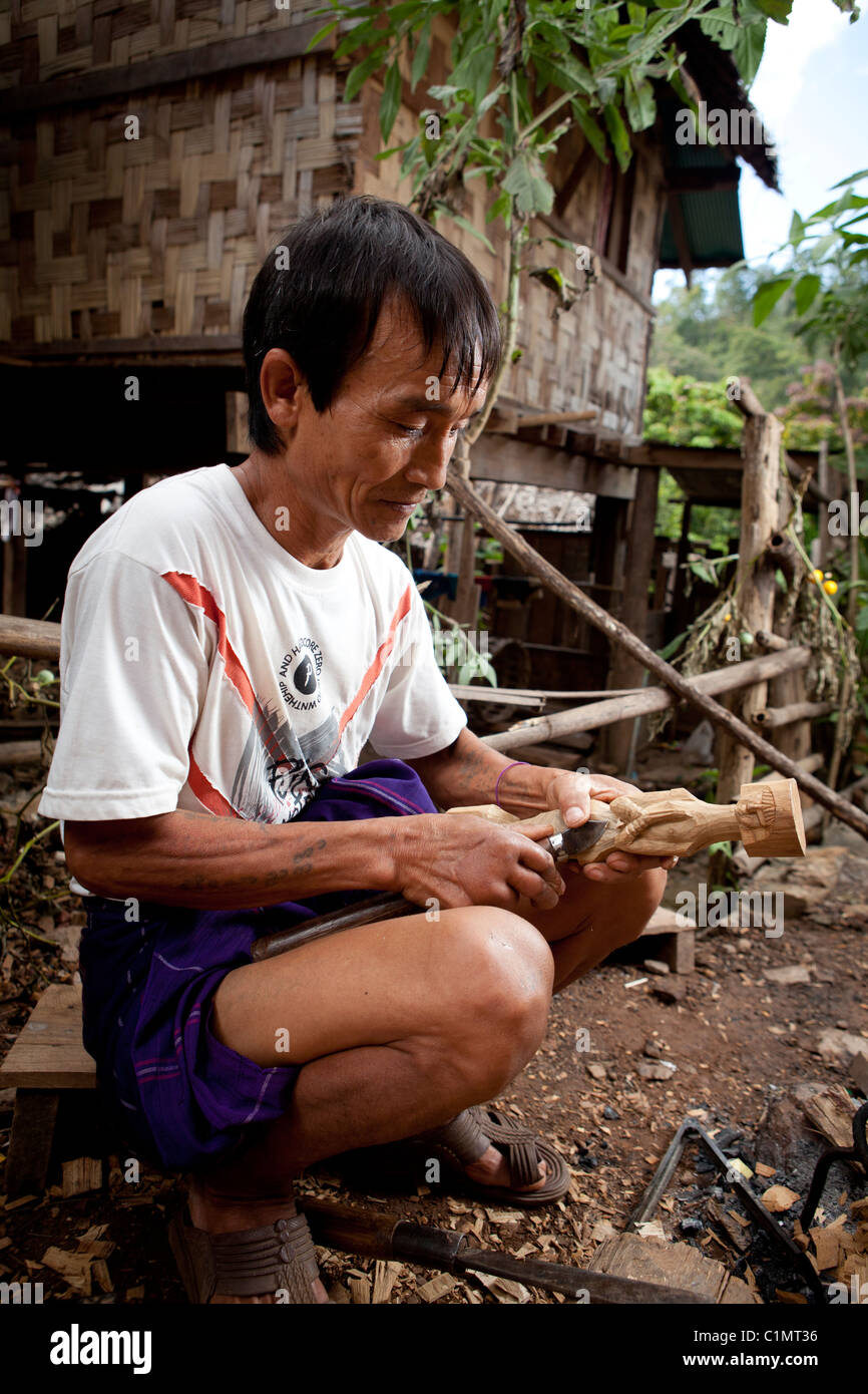 Karen Long Neck man carving Long neck wooden doll, Huay Pu Keng Stock ...