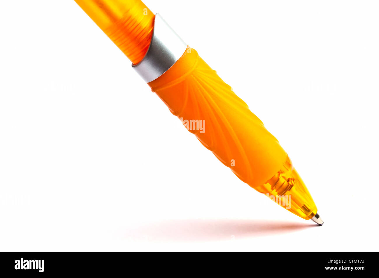 Yellow pen closeup on the white background Stock Photo - Alamy