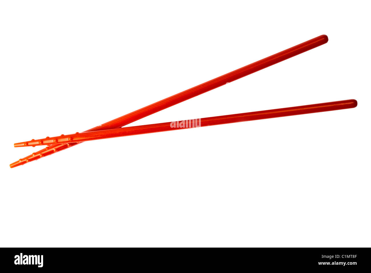 Red chopsticks isolated on white background Stock Photo - Alamy