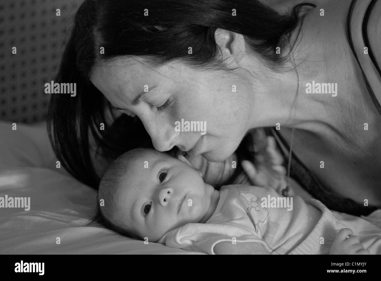 Mother's Love Behavior for her Newborn Daughter Stock Photo - Alamy
