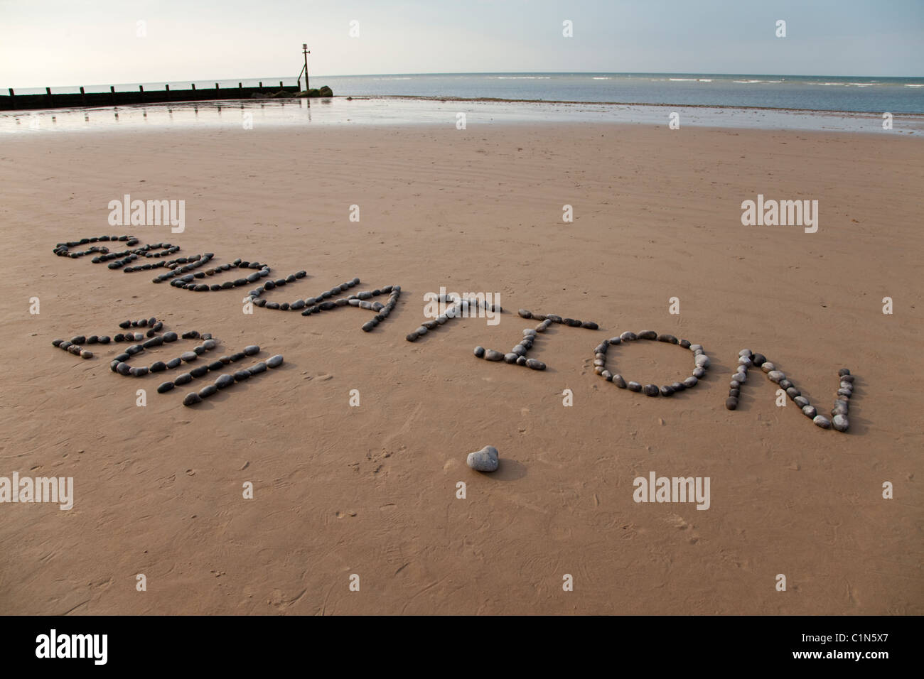 Graduation 2011 sign made from pebbles on beach Cromer Norfolk East ...