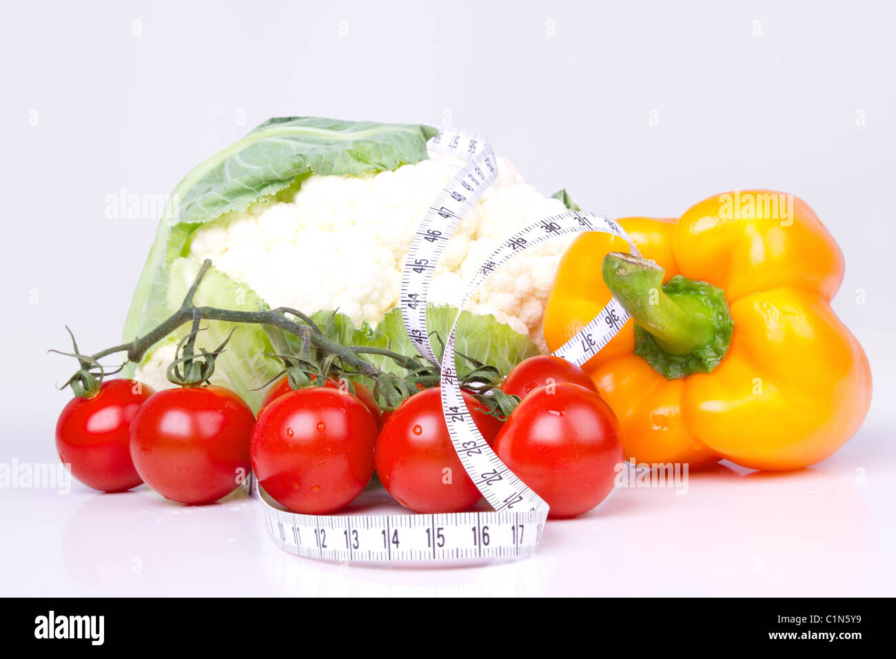 Vegetables rounded measuring tape Stock Photo - Alamy