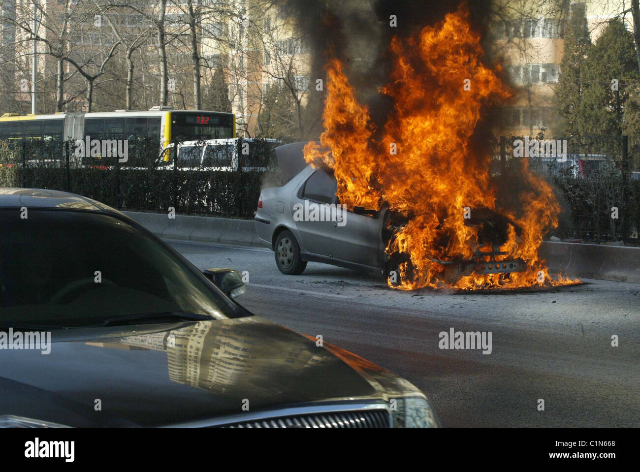 Car explodes Dramatic scenes as a car explodes in the street in Beijing ...