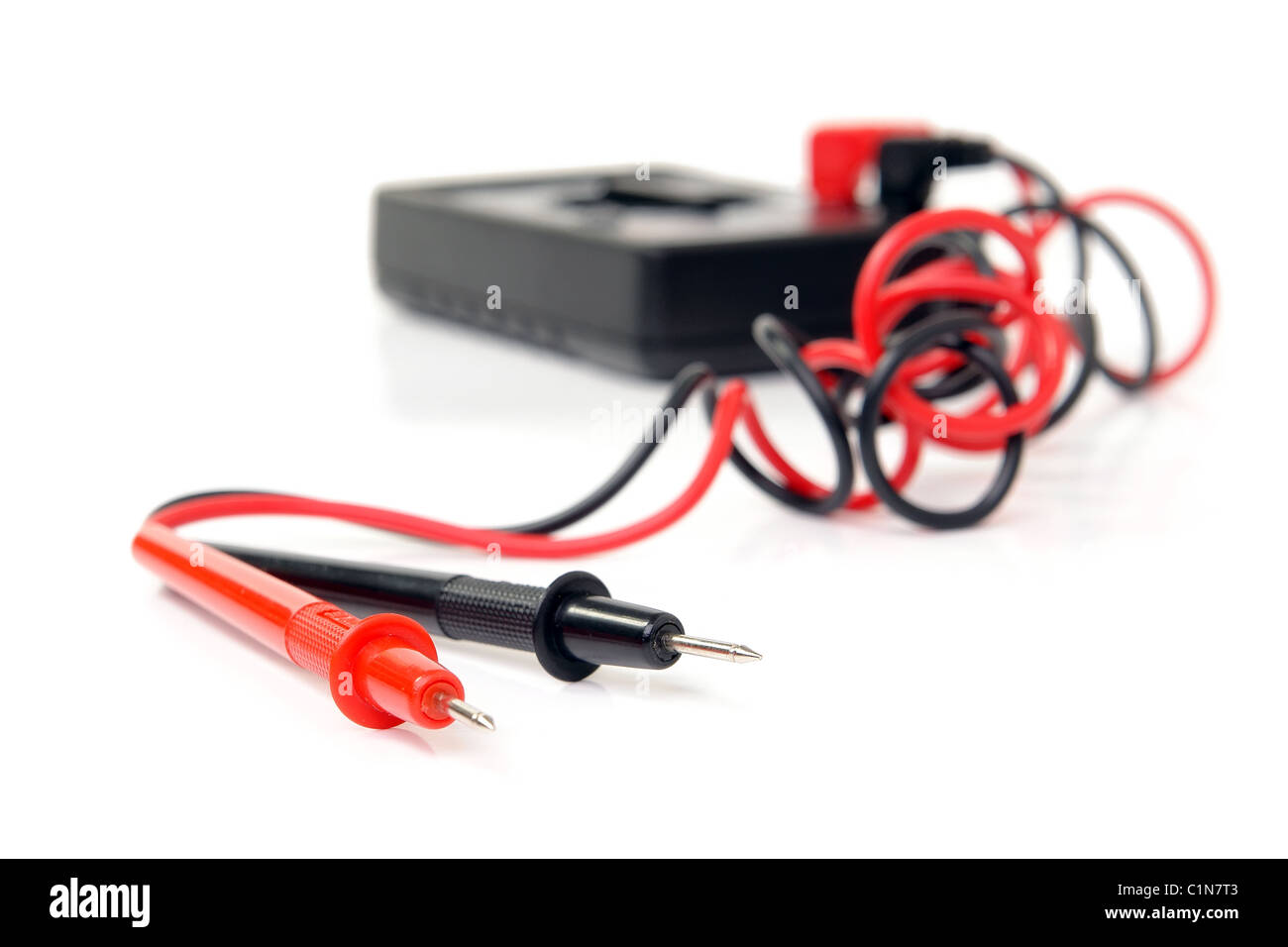 Black multimeter with black and red probes over white background Stock ...