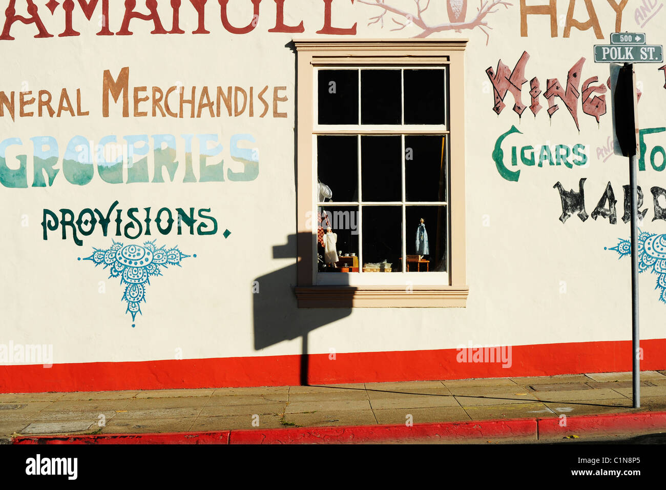 Detail of the side of a shop with hand painted stylized signage on Polk ...