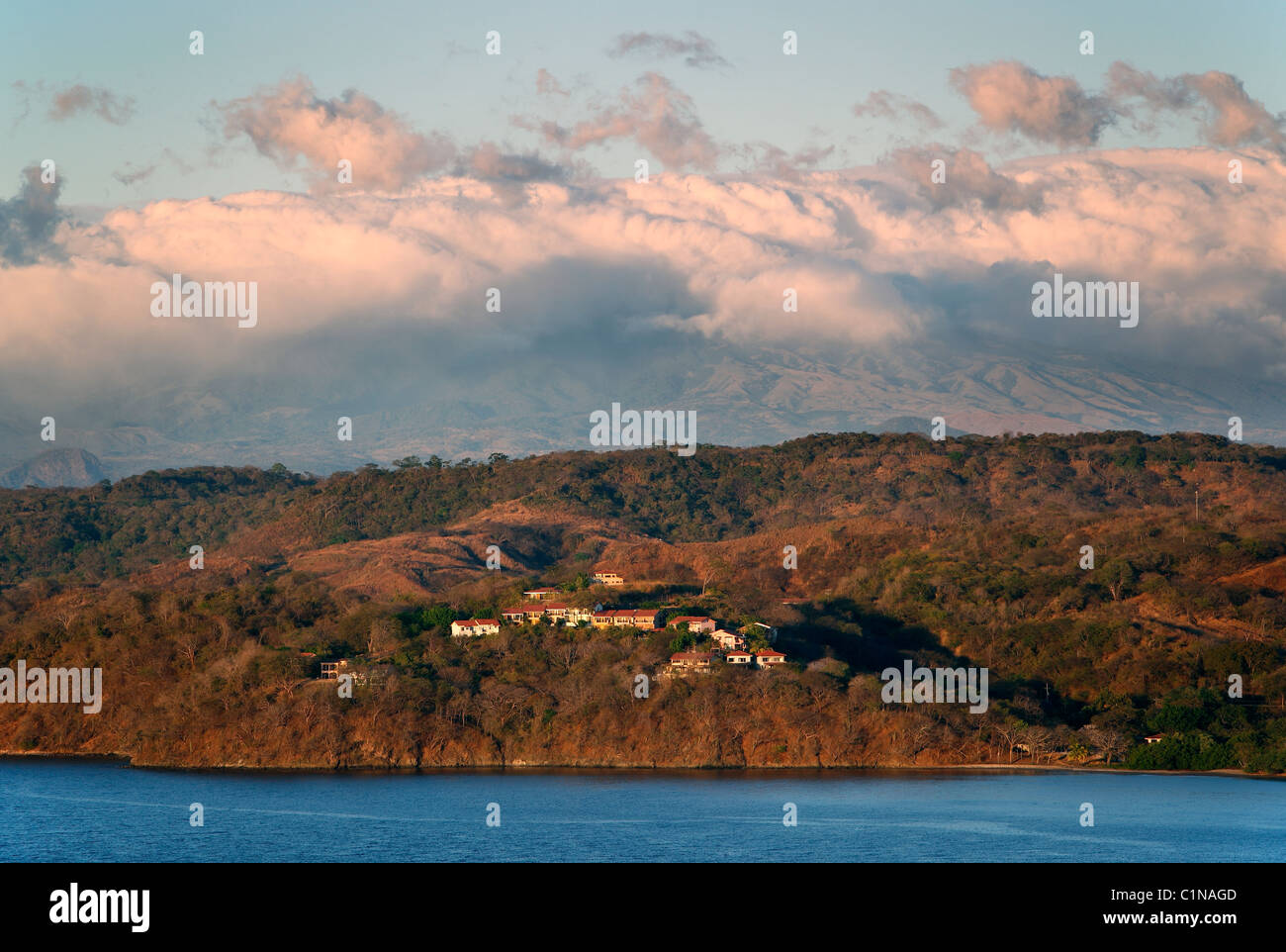 Houses on the Bahia de Culebra with Rincon de la Vieja volcano in the ...