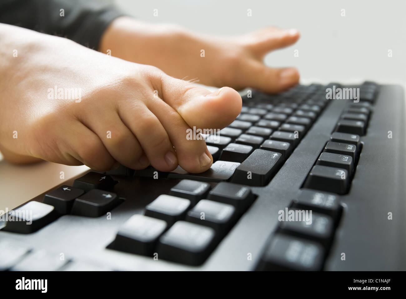 Image of female toes pushing enter key during computer work Stock Photo ...