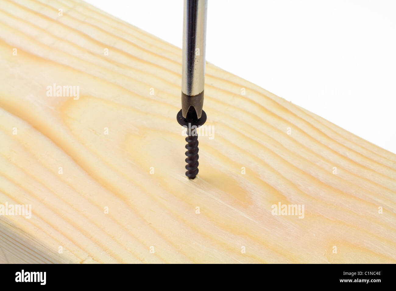 Screwdriver and screw in lumber Stock Photo - Alamy