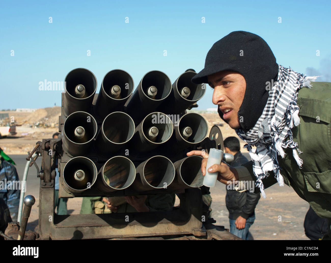 Rebel reloads rocket launcher. Ras Lanuf, Libya Stock Photo - Alamy