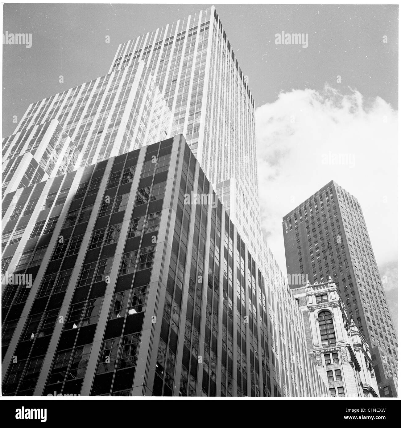 America, 1950s. View from street level of office building (skyscrapper ...