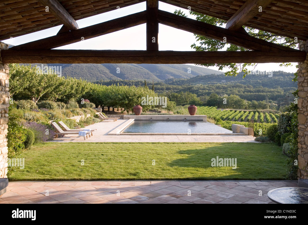 Infinity pool in garden with rural provencal views Stock Photo - Alamy