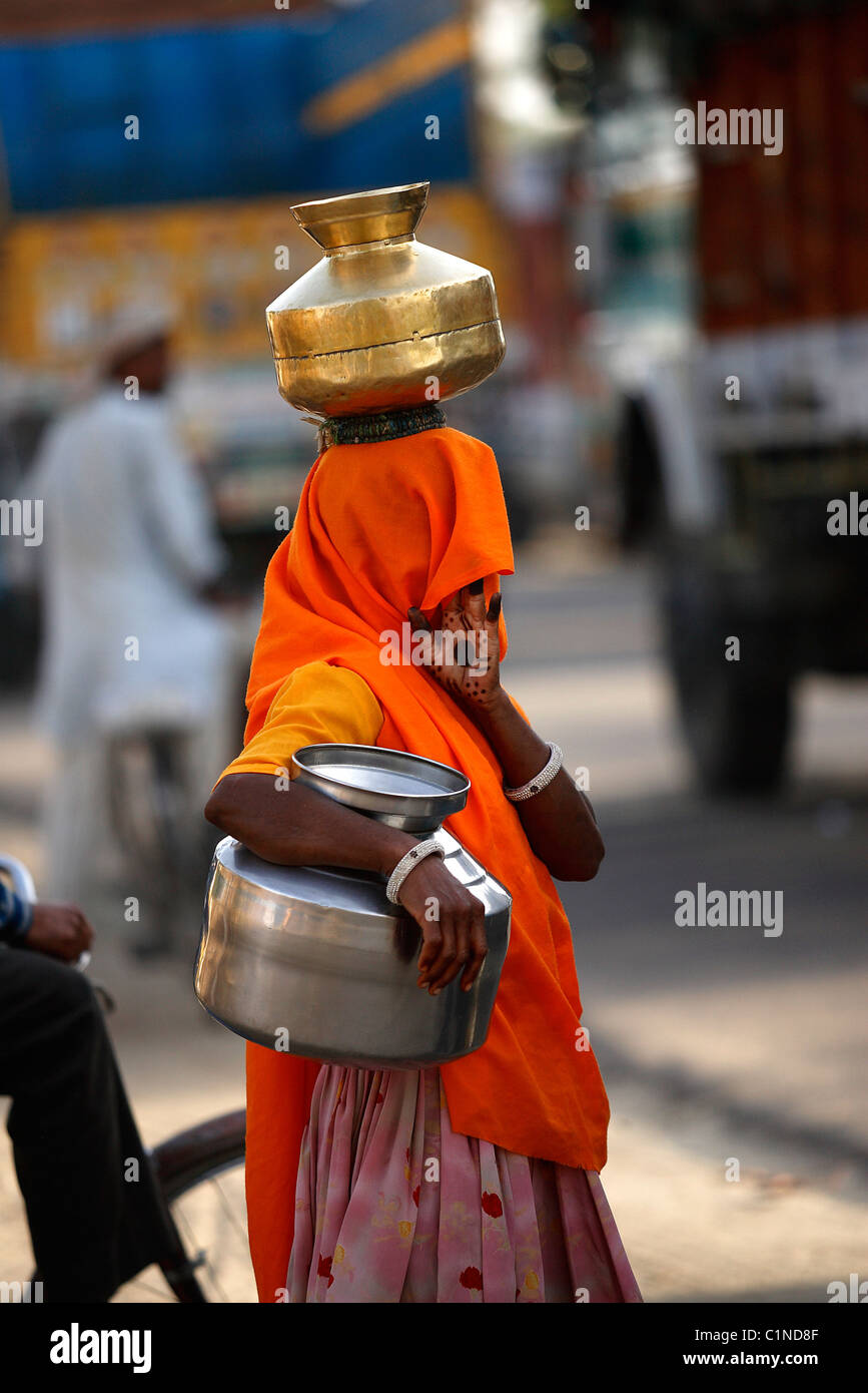 Carrying water jars hi-res stock photography and images - Alamy