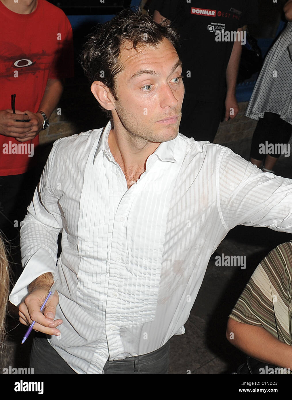 Jude Law is swamped by a huge number of fans wanting his picture and ...