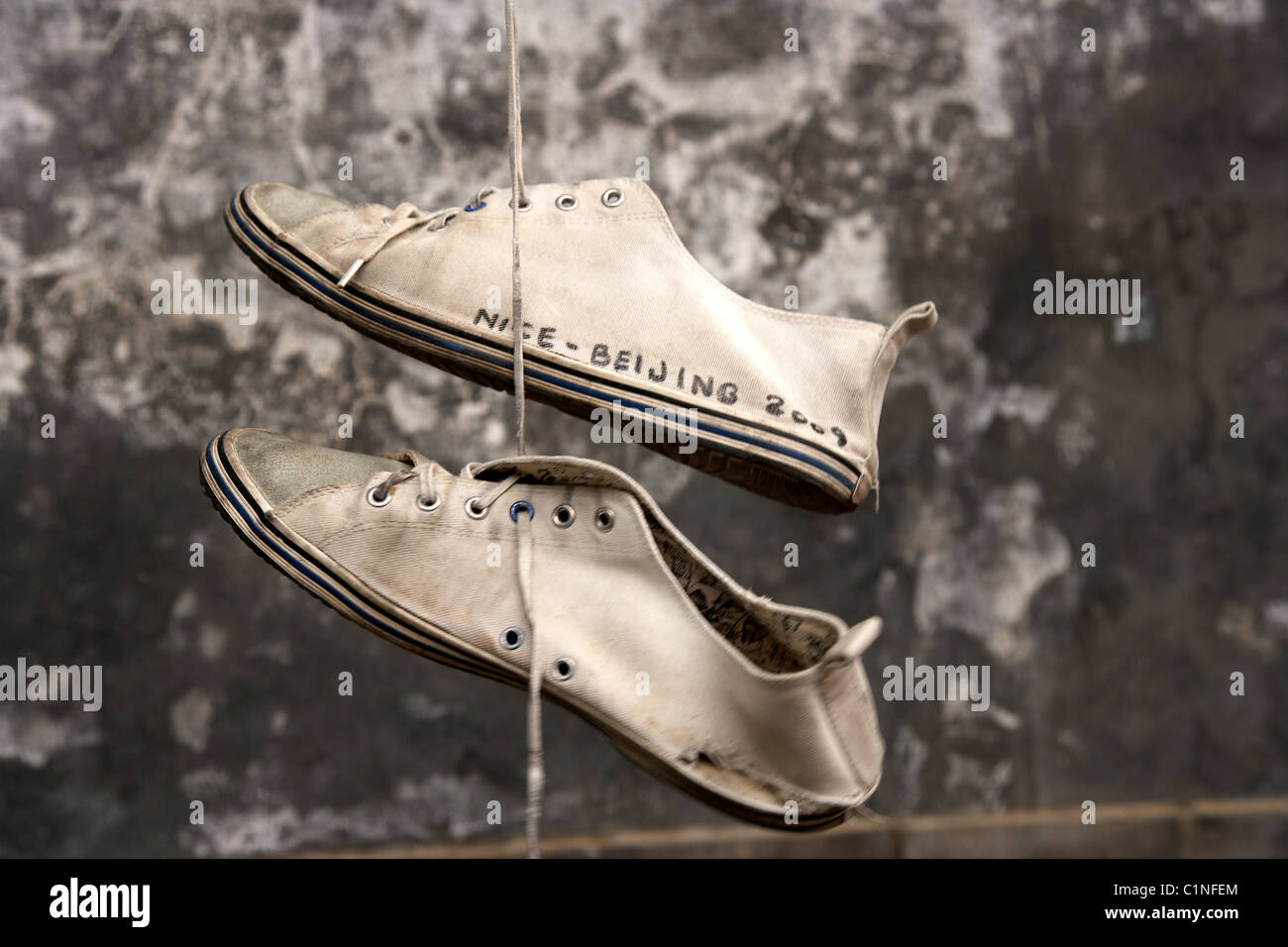 Hanging white trainers Nike Beijing 2009 Stock Photo - Alamy