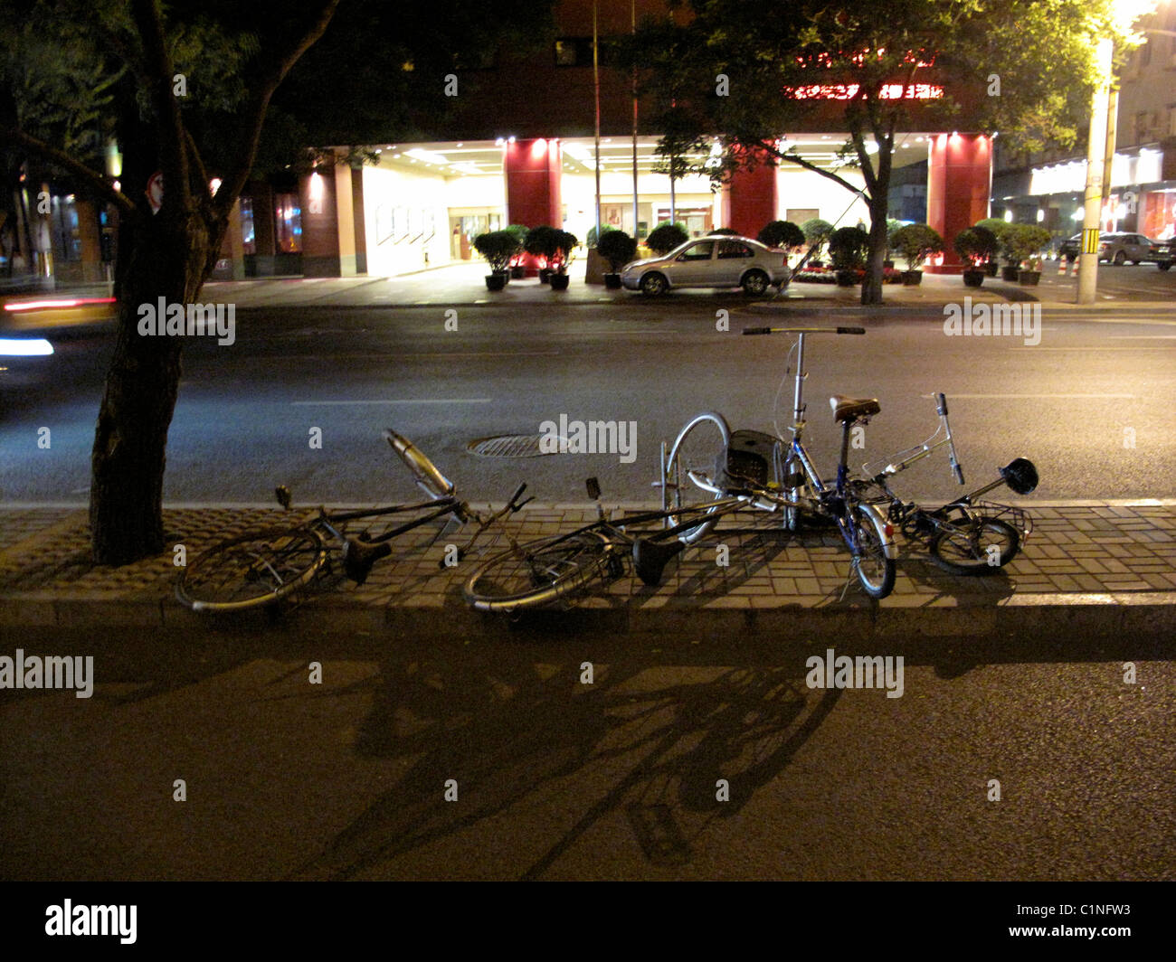 Fallen down bicycles in the streets of China Stock Photo - Alamy