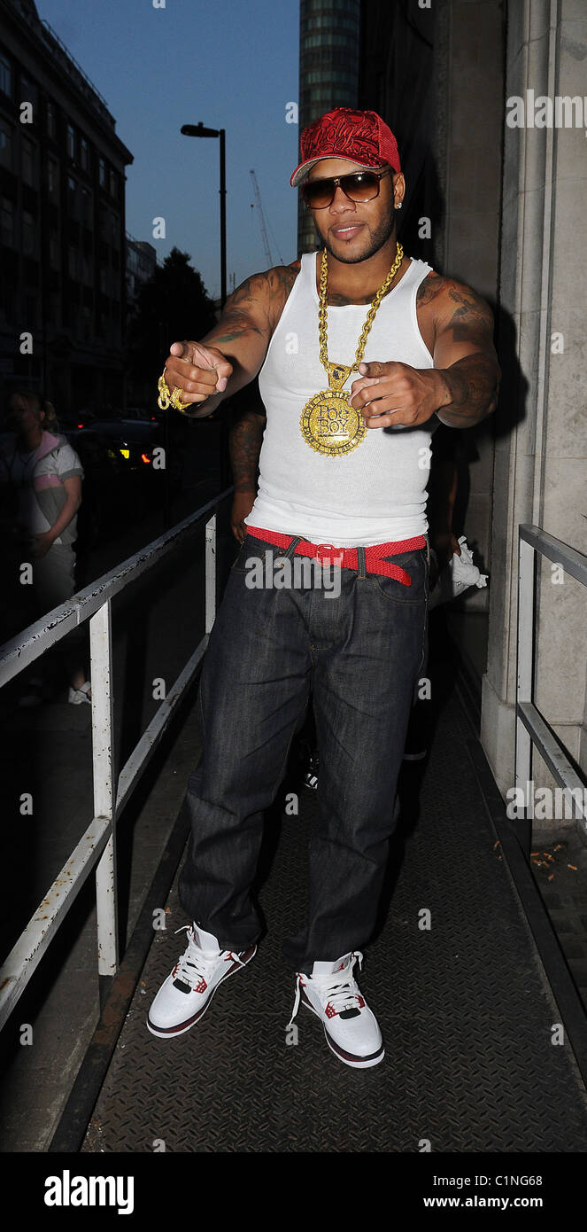 Flo Rida at Radio 1 wearing a huge gold medallion inscribed with his ...