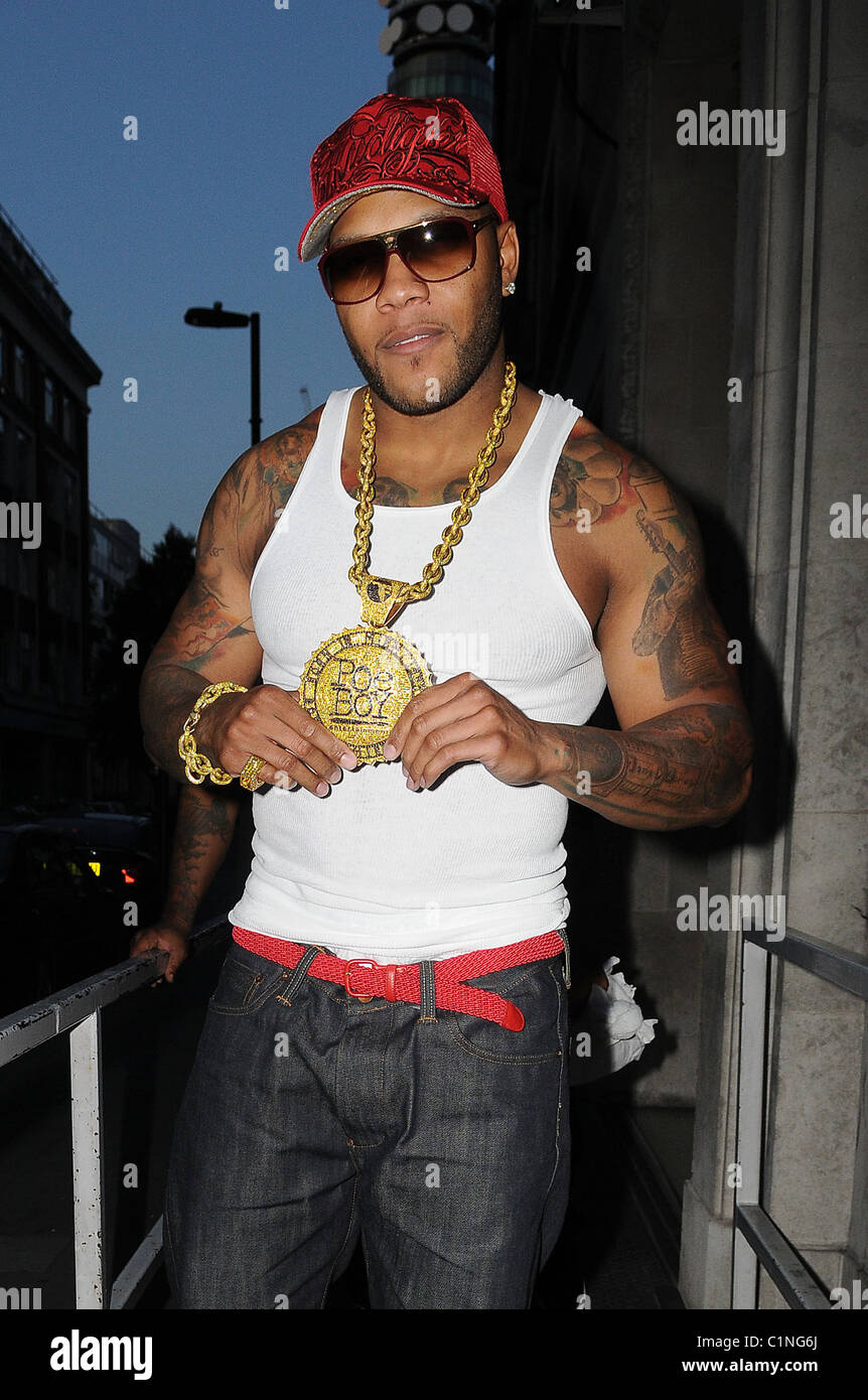 Flo Rida at Radio 1 wearing a huge gold medallion inscribed with his ...