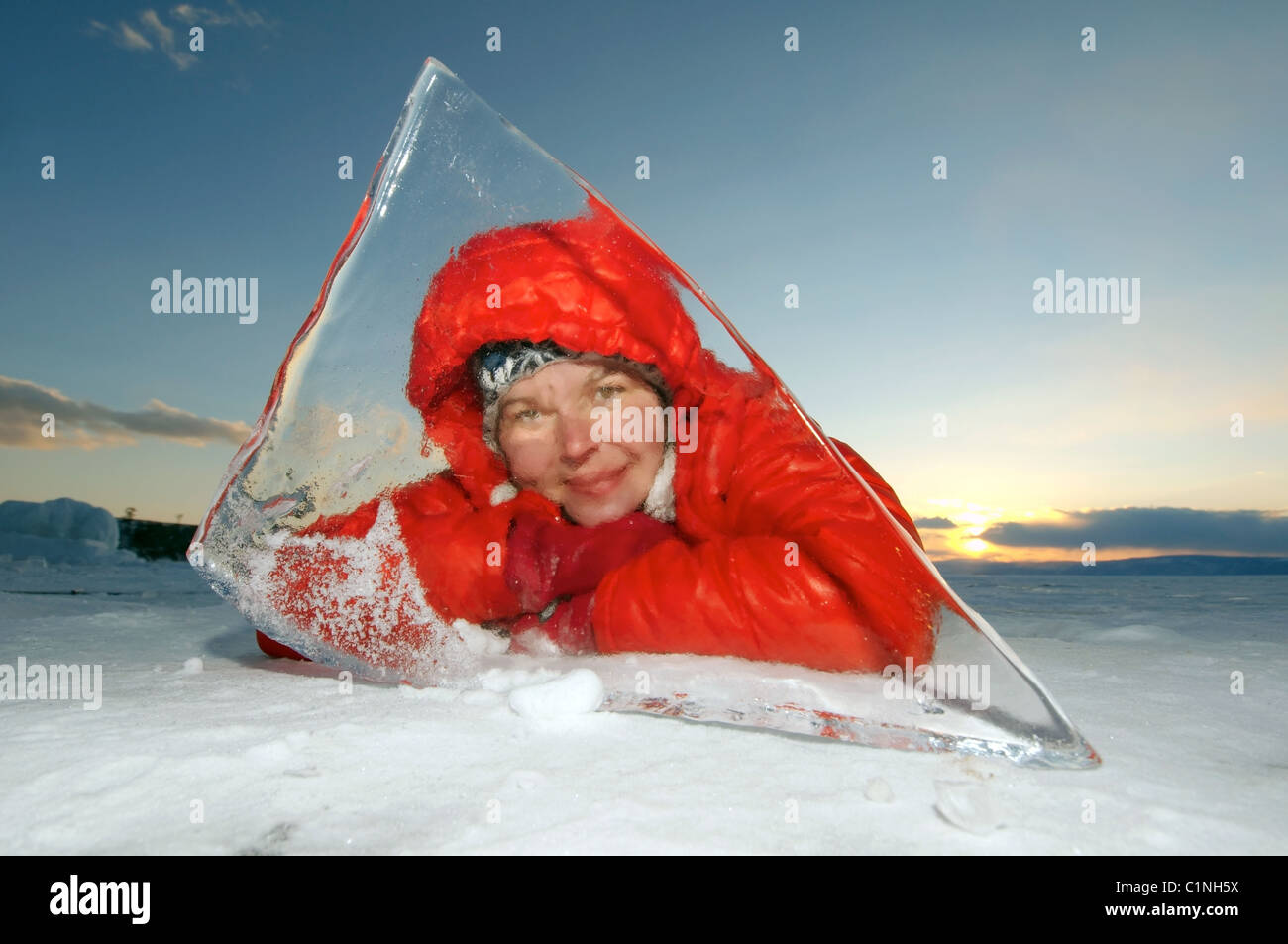 Woman looks through ice Stock Photo - Alamy
