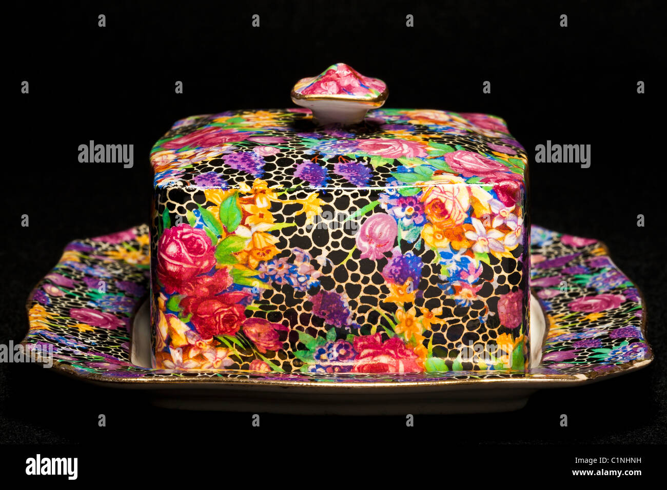 colorful antique butter dish on black background Stock Photo - Alamy