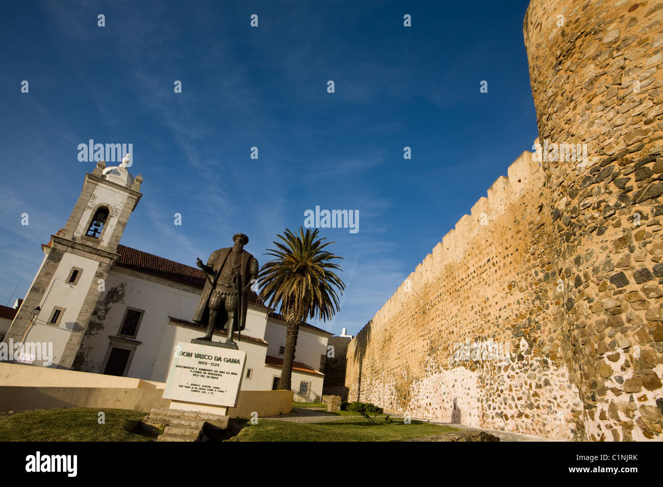 Statue of Vasco da Gama is next to ancient castle, Sines, Portugal, in ...