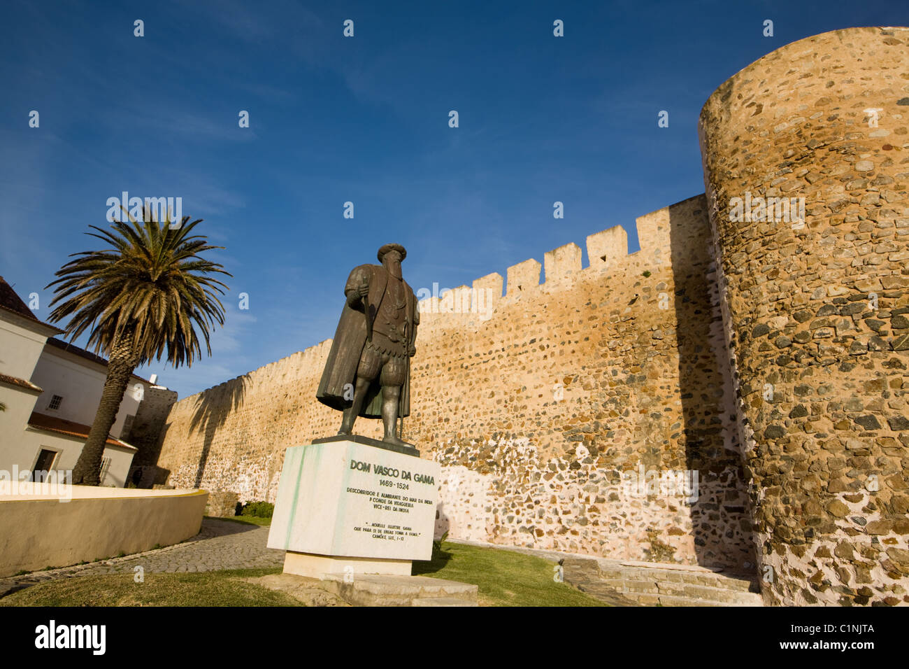 Statue of Vasco da Gama is next to ancient castle, Sines, Portugal, in ...