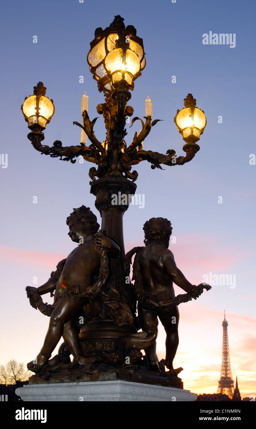 France, Paris, candelabra on Alexander III Bridge and the Eiffel Tower ...
