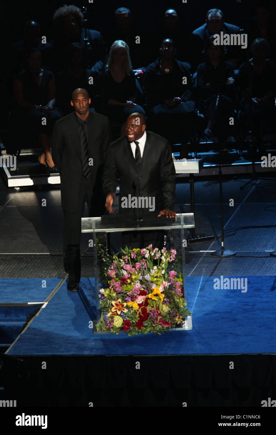 Earvin Johnson AKA Magic Johnson speaks as Kobe Bryant stands behind ...